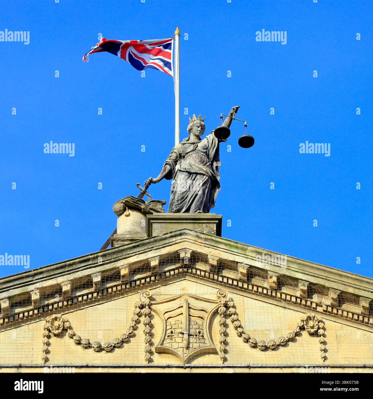 Statue figure representing Justice and the union flag on the roof of ...
