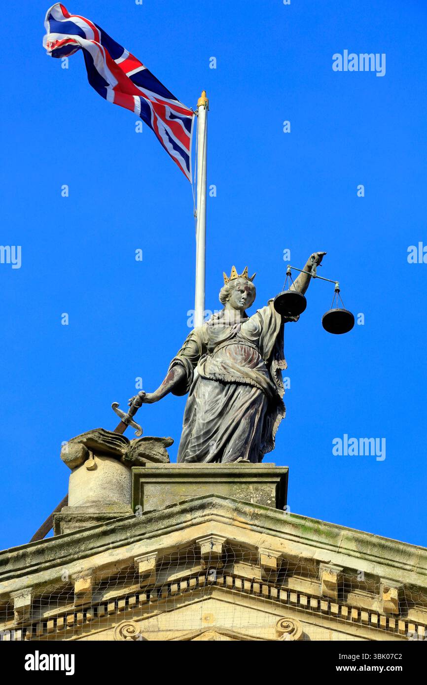 Statue figure representing Justice and the union flag on the roof of ...