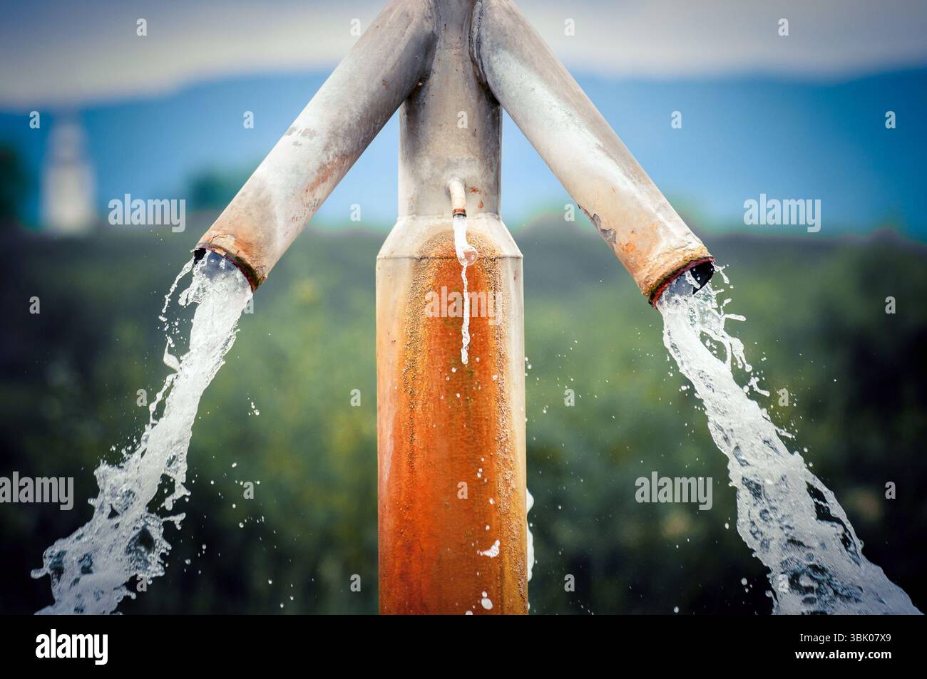 Water flowing from outdoor tap and getting wasted Stock Photo - Alamy