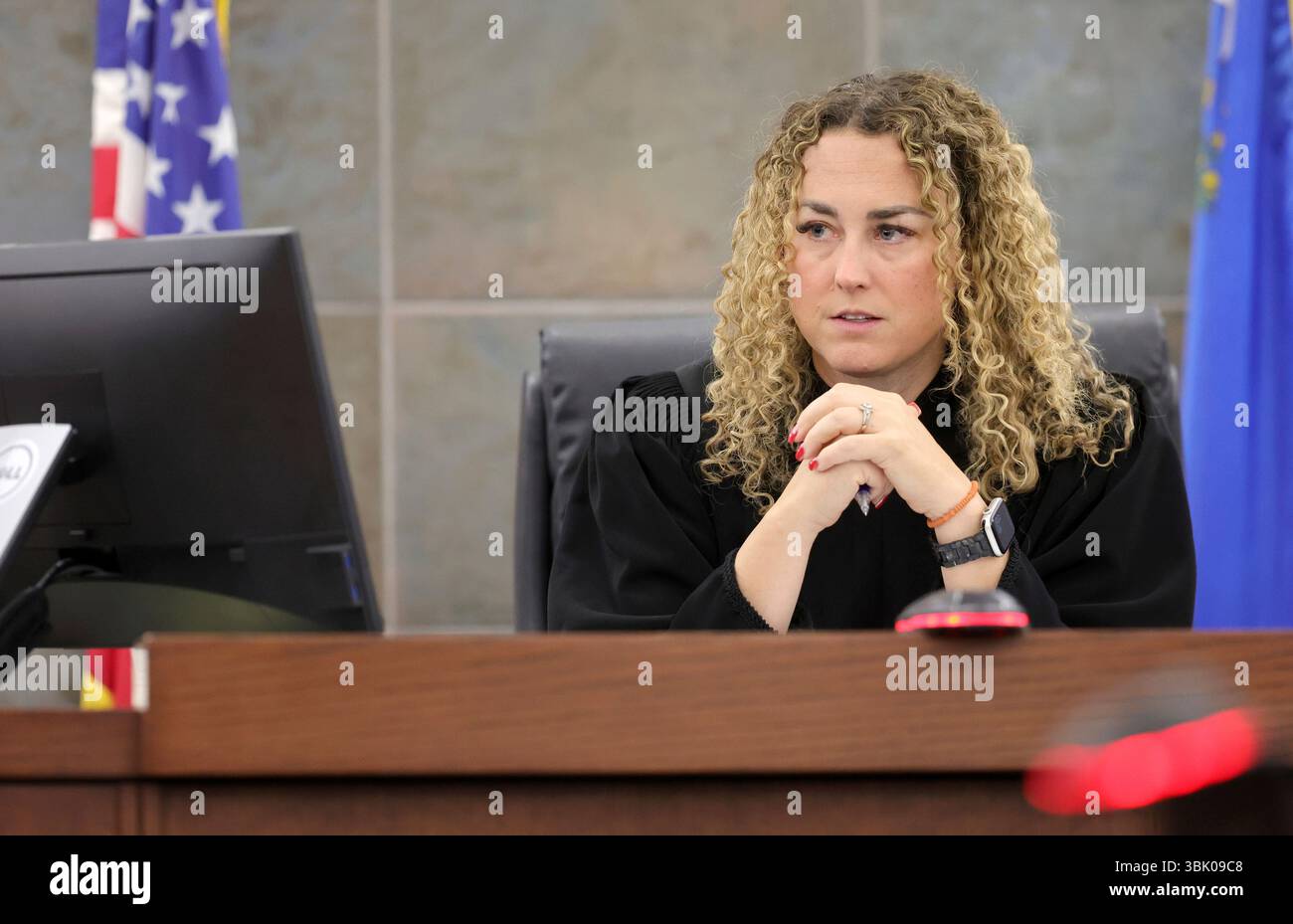 District Judge Carli Kierny presides over a trial readiness status ...
