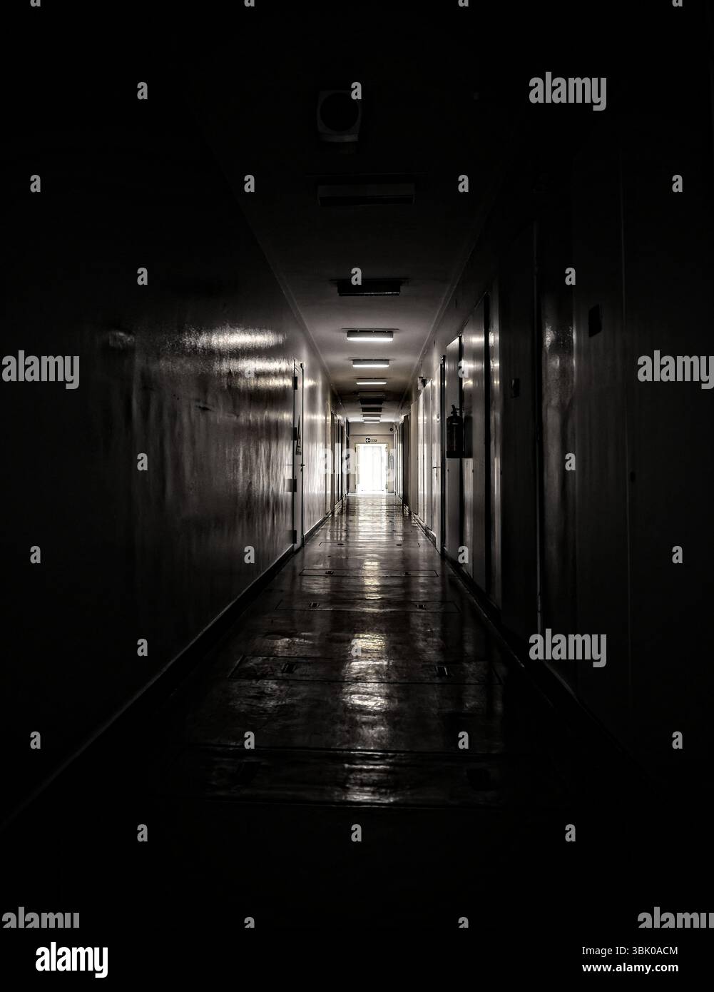 Light through window at dark corridor hallway Stock Photo - Alamy