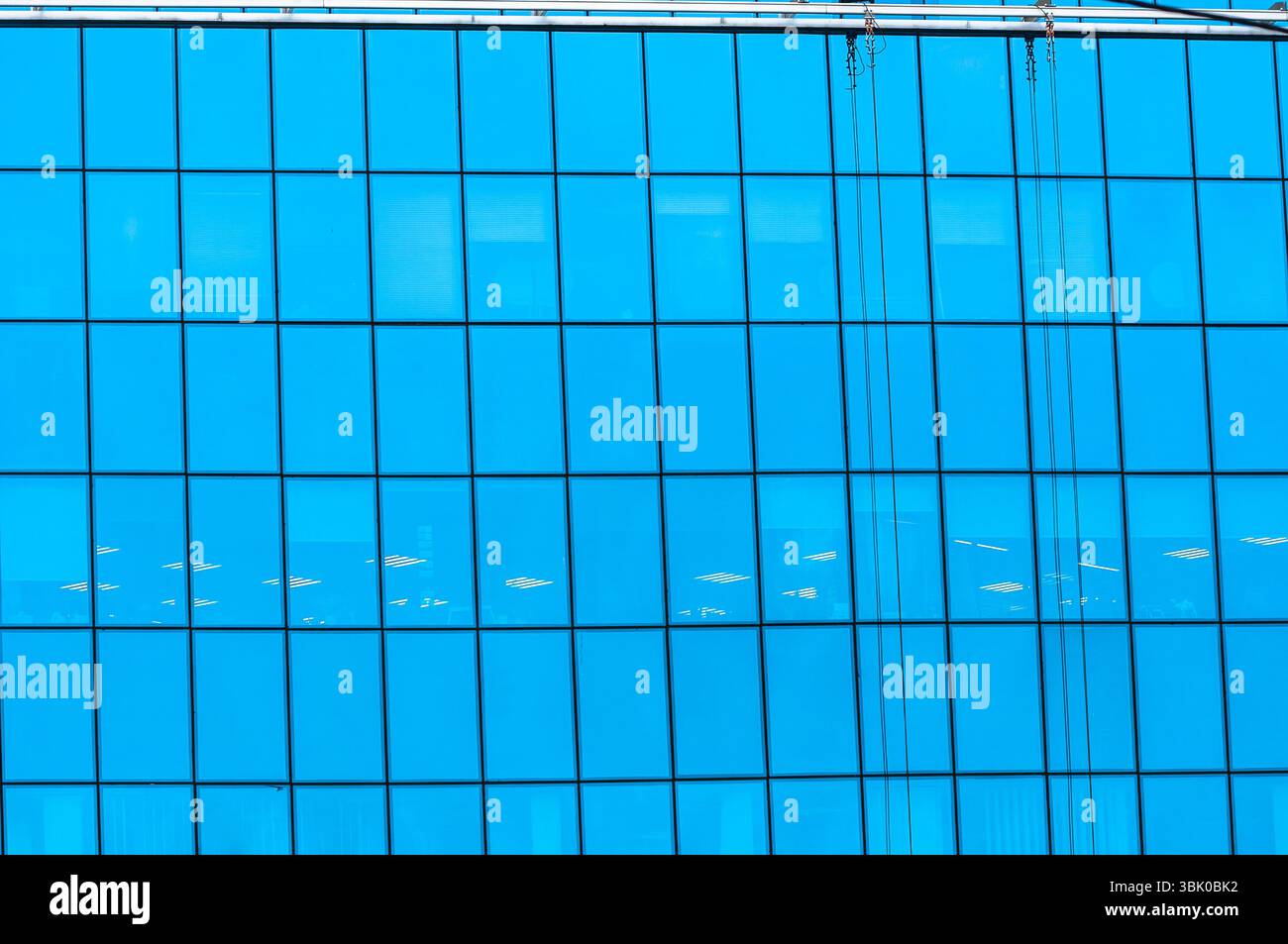 Blue windows of an office with reflection Stock Photo - Alamy