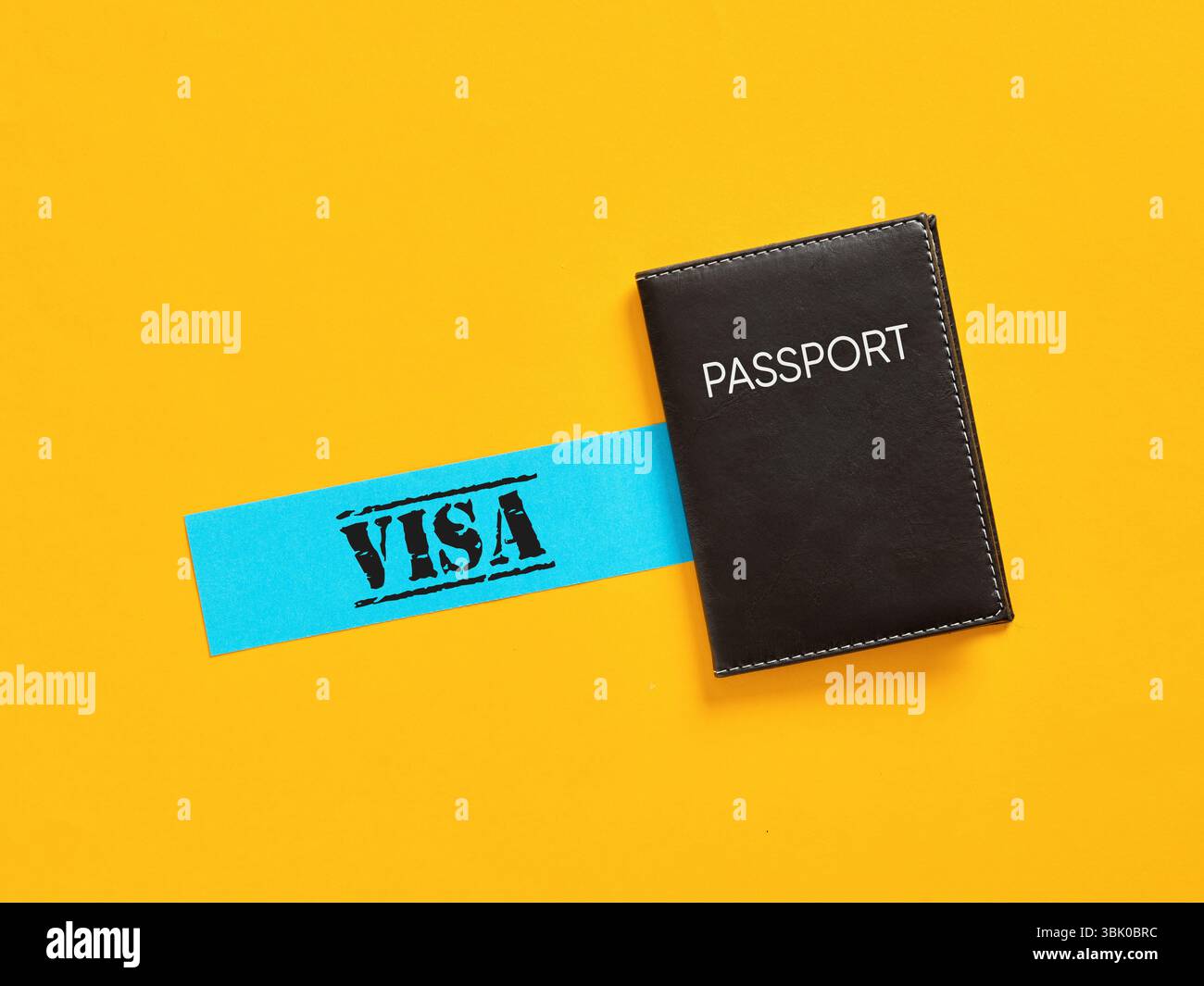 Black passport lying near blue paper showing visa approval on yellow ...