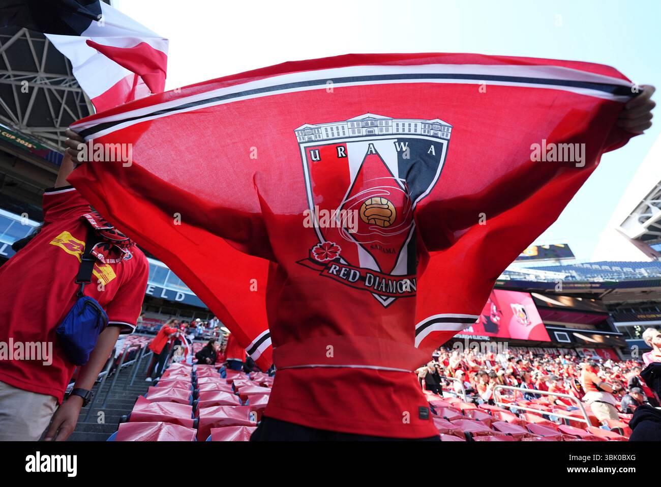 A Urawa supporter holds up a flag before the Club World Cup group E ...