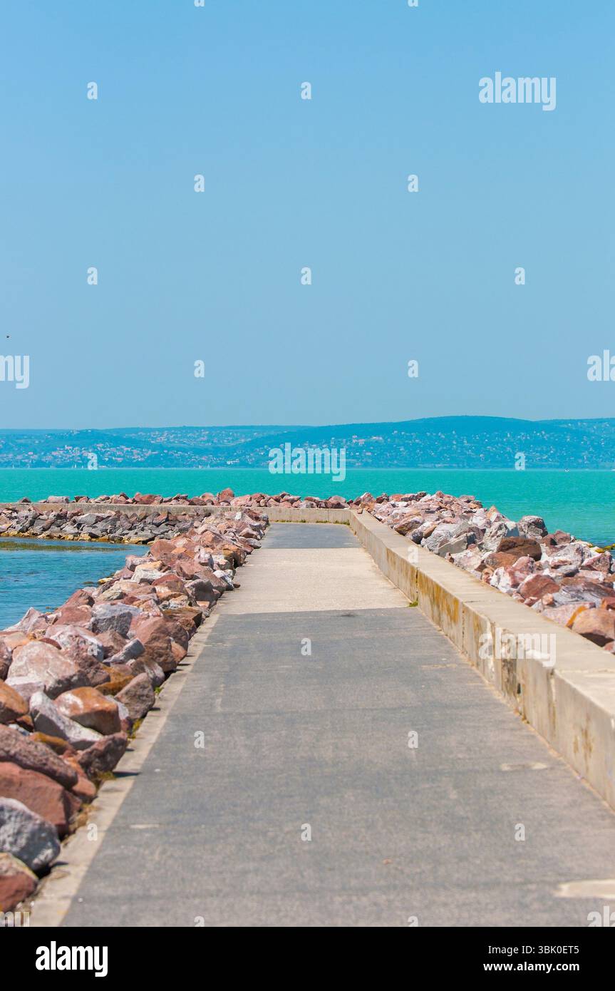 Blue sea stone dock background hi-res stock photography and images - Alamy