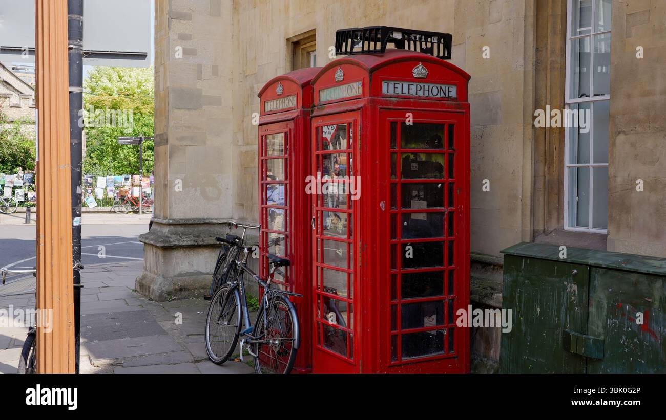 CAMBRIDGE, UK - JUNE 11, 2025 - Two iconic red telephone booths are ...