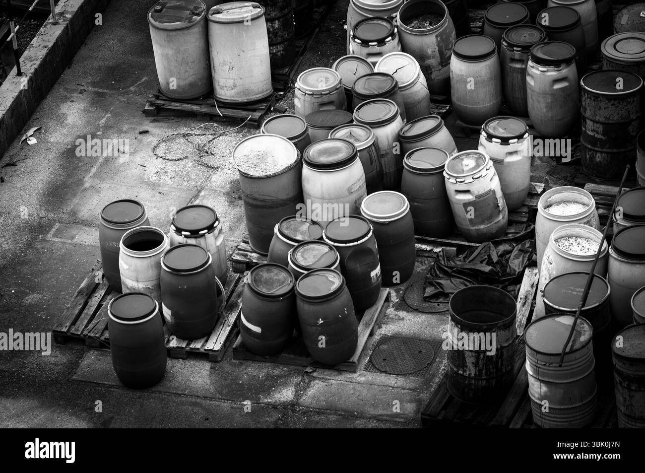 Photo of a Chemical waste dump with a lot of barrels Stock Photo - Alamy