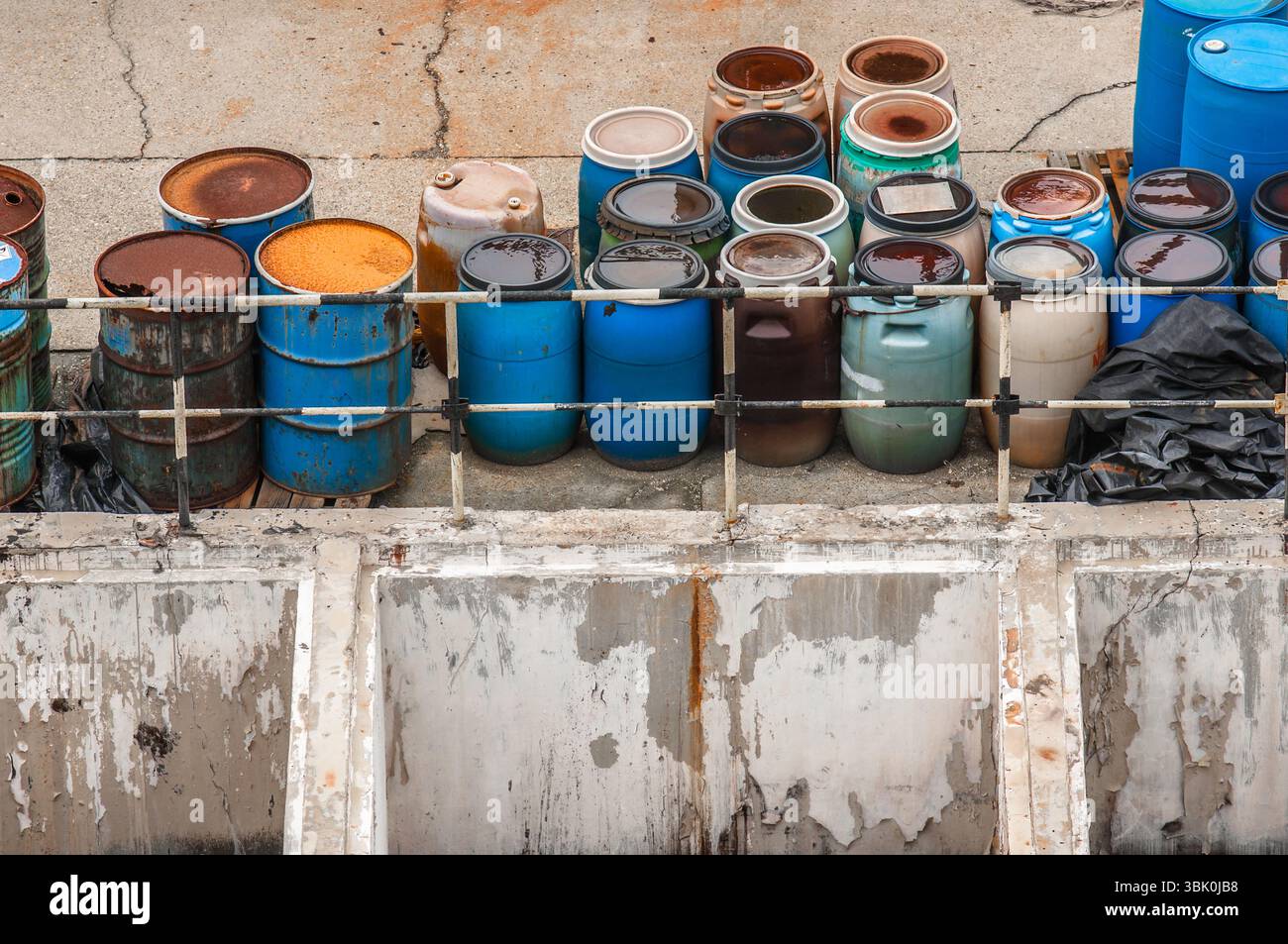 Photo of a Chemical waste dump with a lot of barrels Stock Photo - Alamy