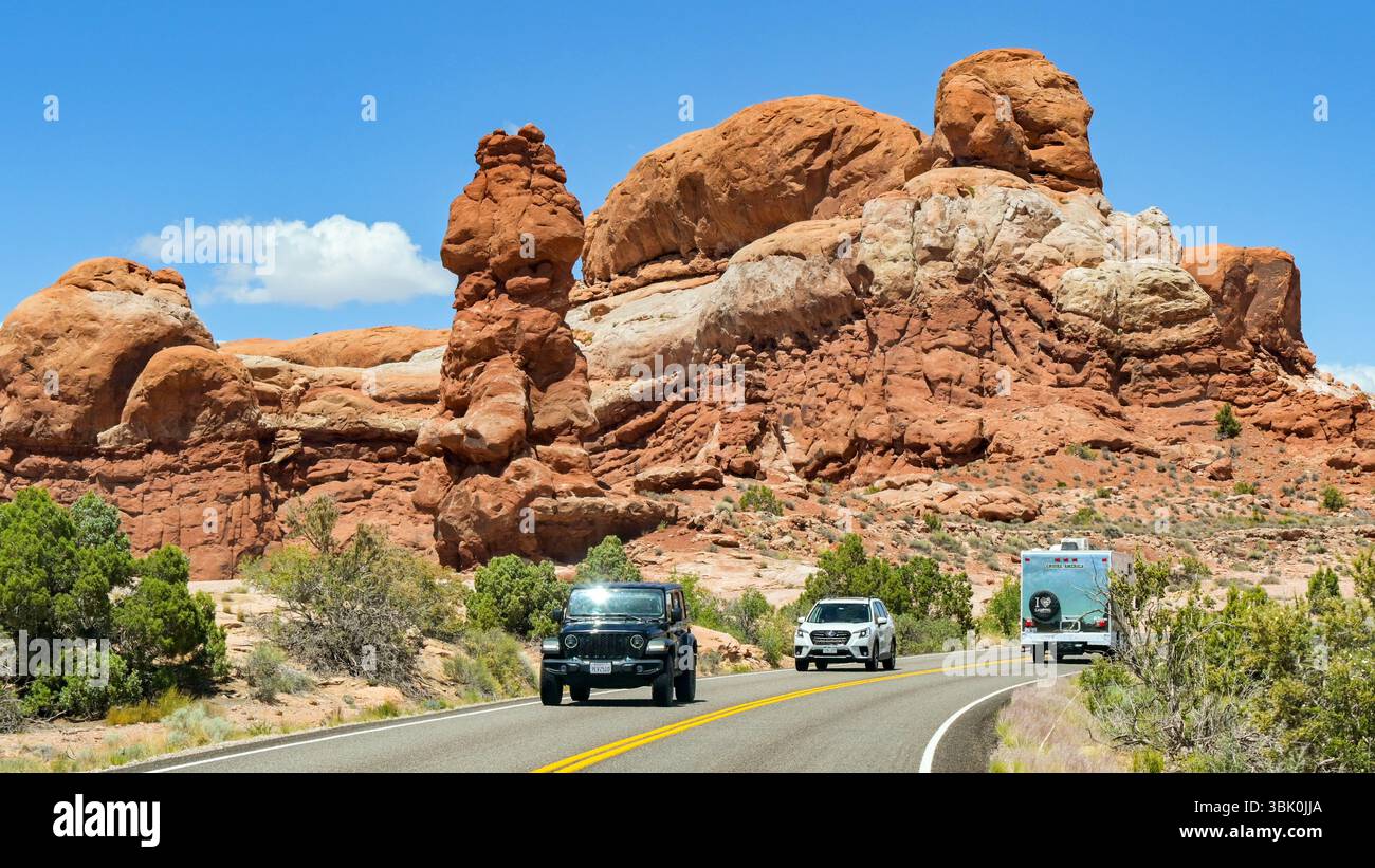 Moab, Utah, USA - 25 May 2025: Cars and a camper van RV driving through ...