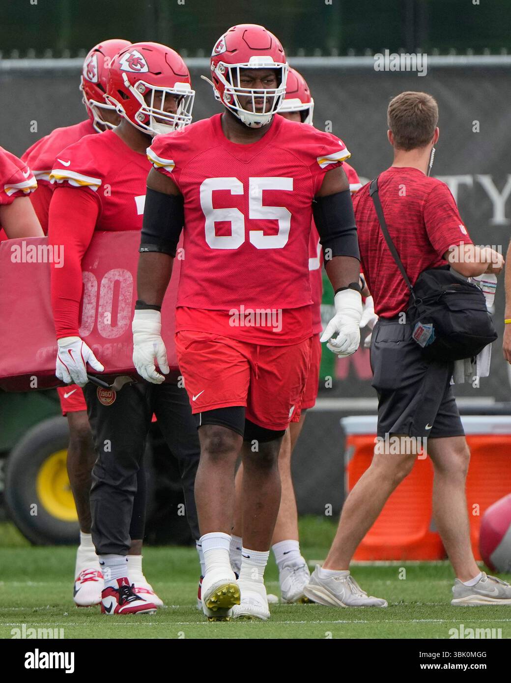 Kansas City Chiefs guard Trey Smith (65) walks to a drill with ...