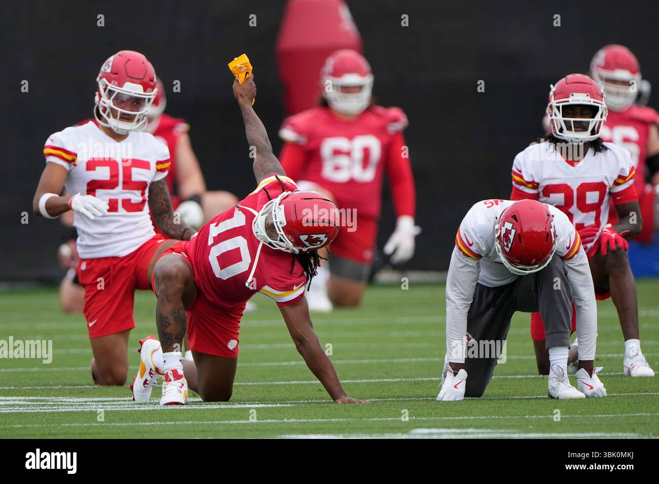 Kansas City Chiefs running back Isiah Pacheco (10) stretches with ...