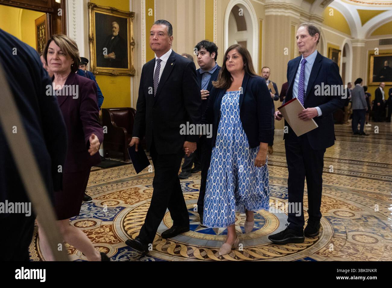 Sen. Alex Padilla (D-Calif.) walks with his wife, Angela Padilla, and ...
