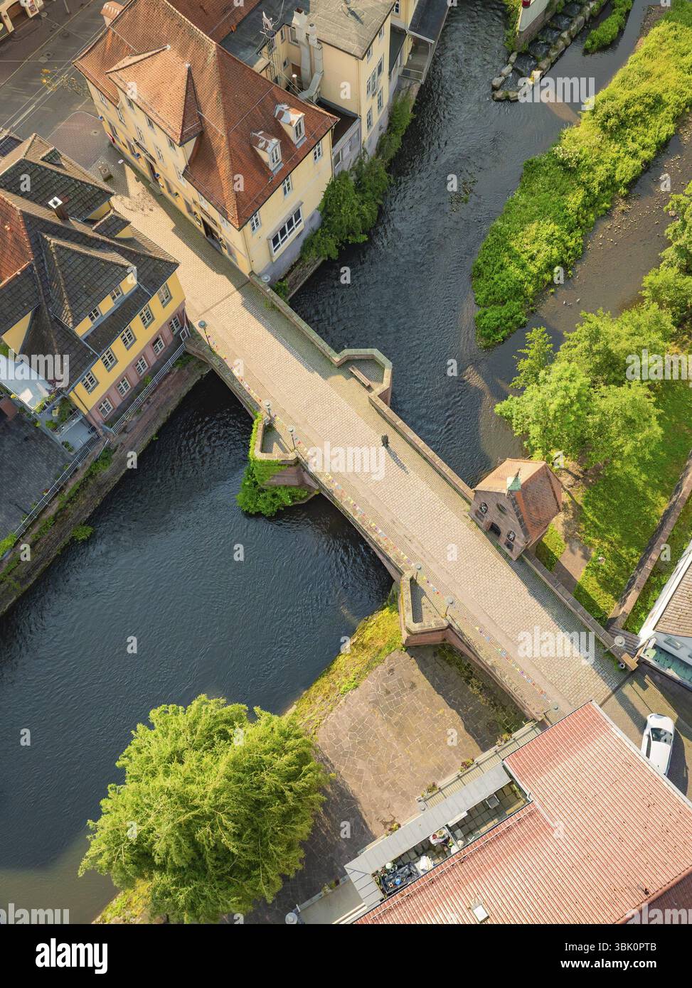 River with stone bridge and neighbouring historic buildings from the ...