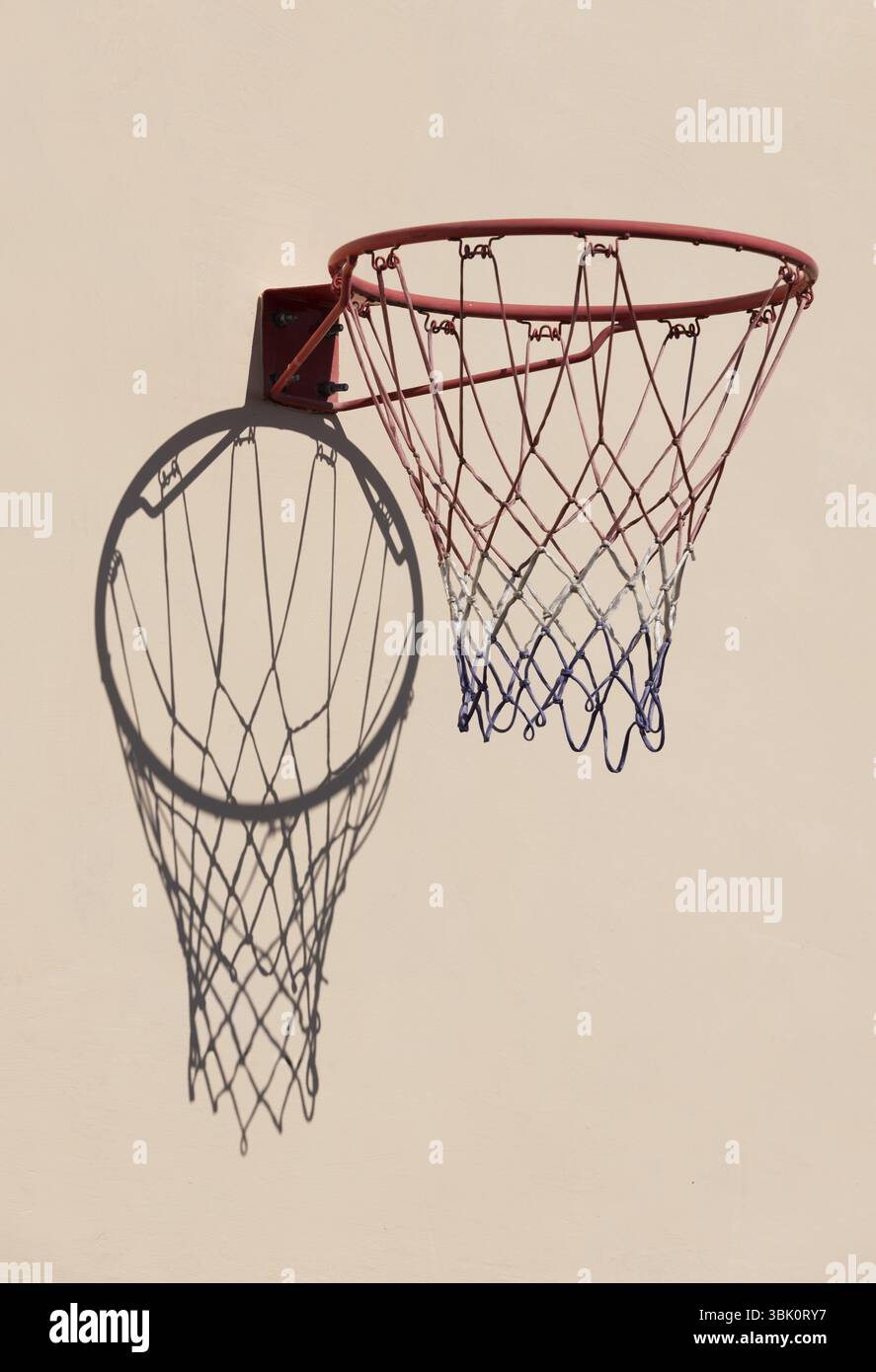 Basketball hoop with shadow cast on a white wall Stock Photo - Alamy