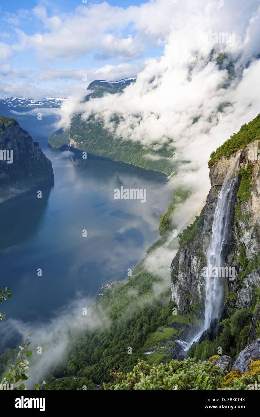Gjerdefossen waterfall, at Ornesvingen viewpoint, atmospheric clouds over the fjord in the ...
