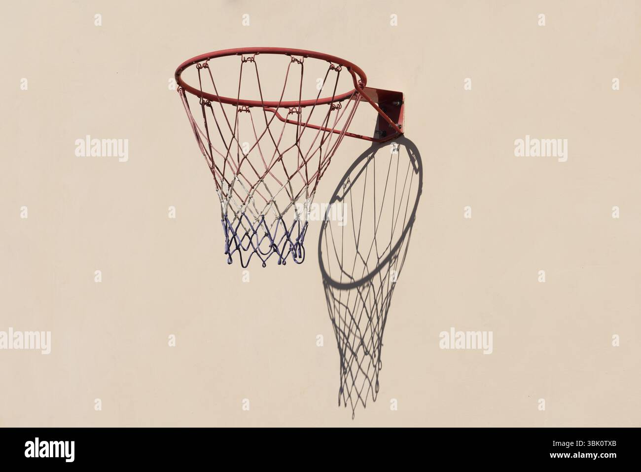 Basketball hoop with shadow cast on a white wall Stock Photo - Alamy