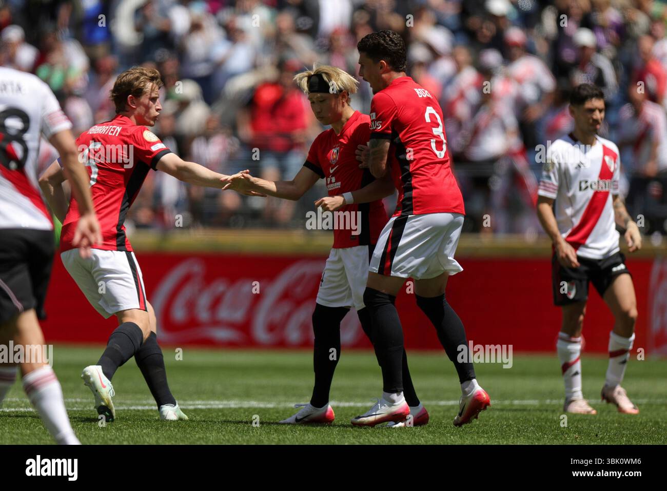 Urawa Red Diamonds' Yusuke Matsuo, center, reacts after scoring his ...