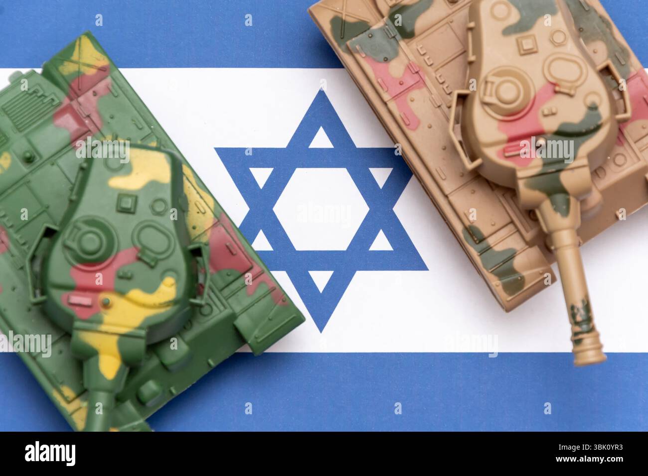 Tanks in camouflage against the background of the Israeli flag ...