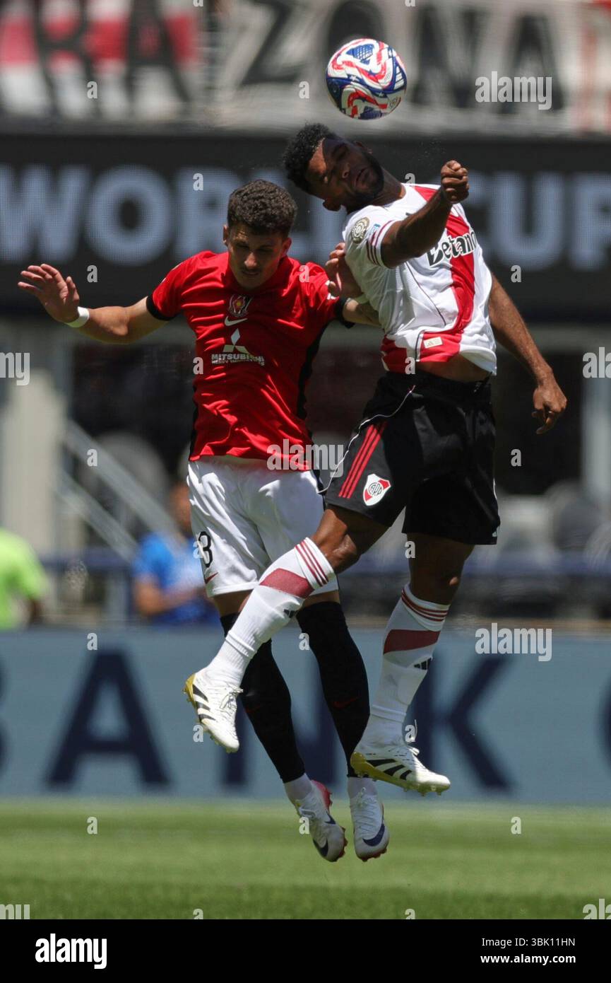 River Plate's Miguel Borja, right, and Urawa Red Diamonds' Matheus Savio battle for the ball ...