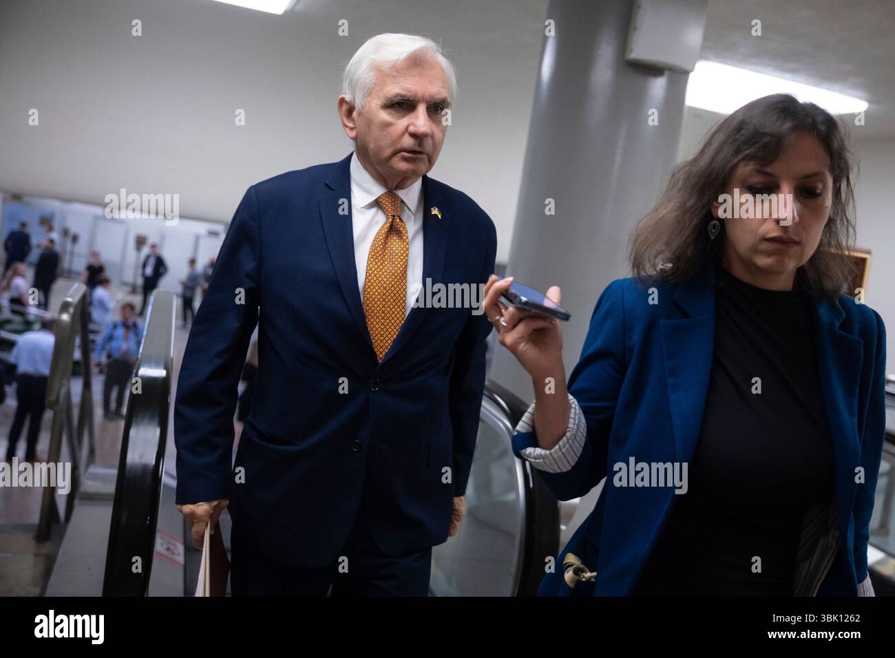 Sen. Jack Reed (D-R.I.) speaks with a reporter as he walks to a vote at ...