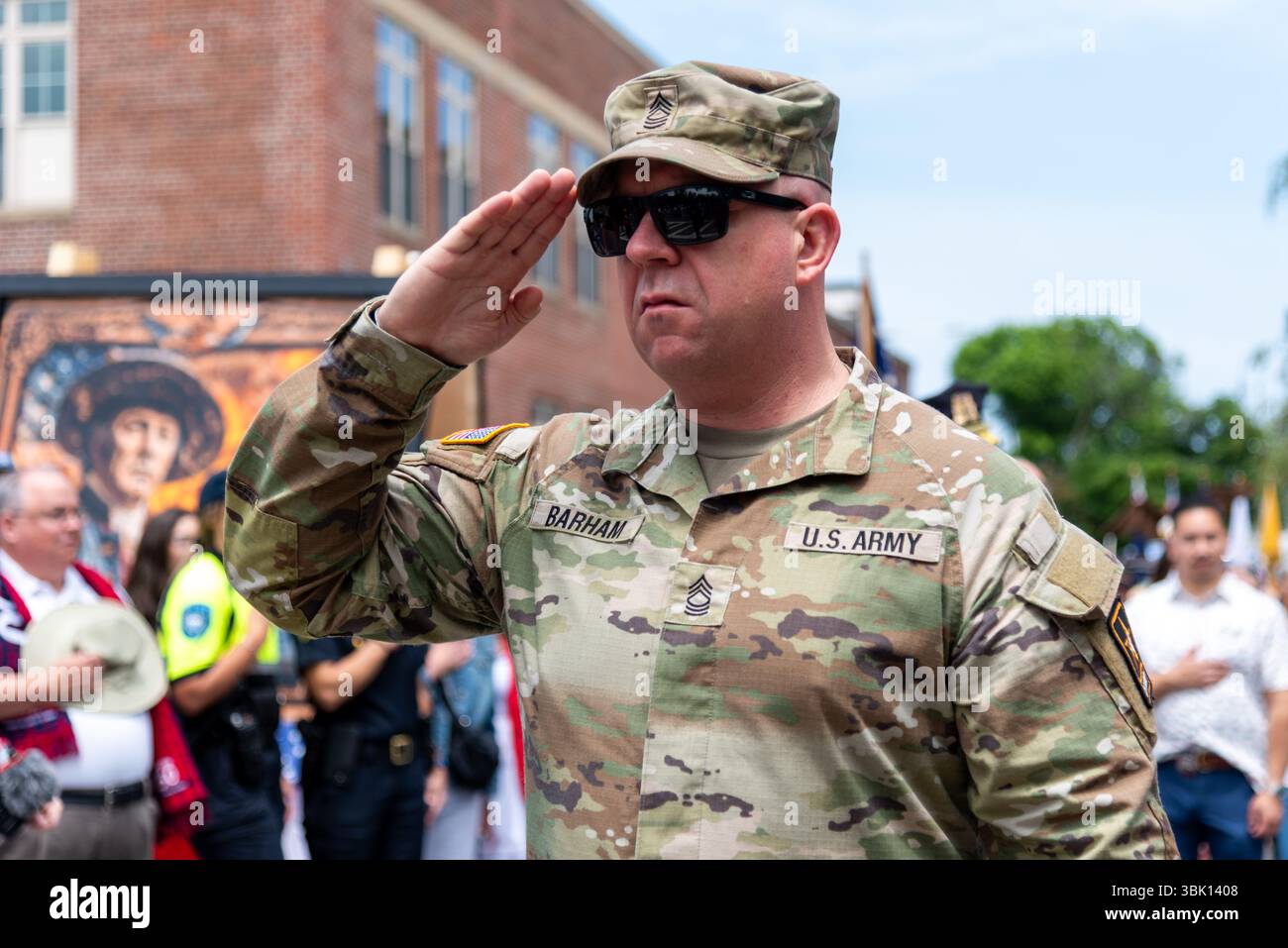 U.S. Army soldier saluting for the national anthem before the Bunker ...