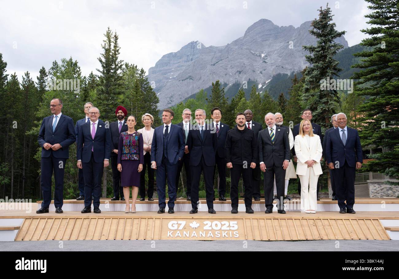 Canada's Prime Minister Mark Carney smiles as he stands with G7 leaders ...