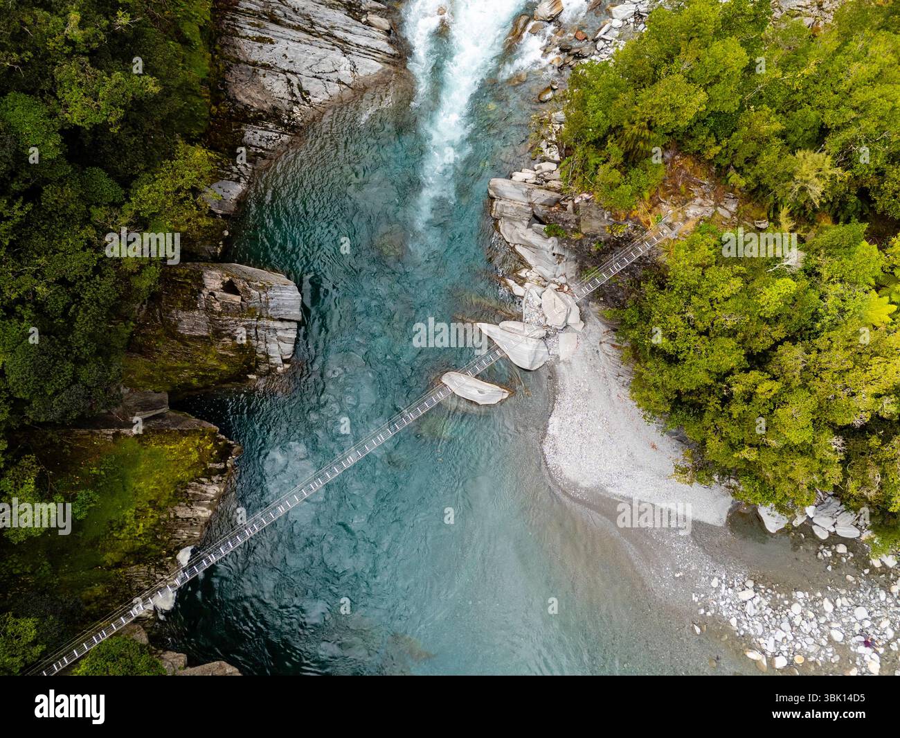 Aerial photograph of a suspension bridge at the Cesspool, Arahura River ...