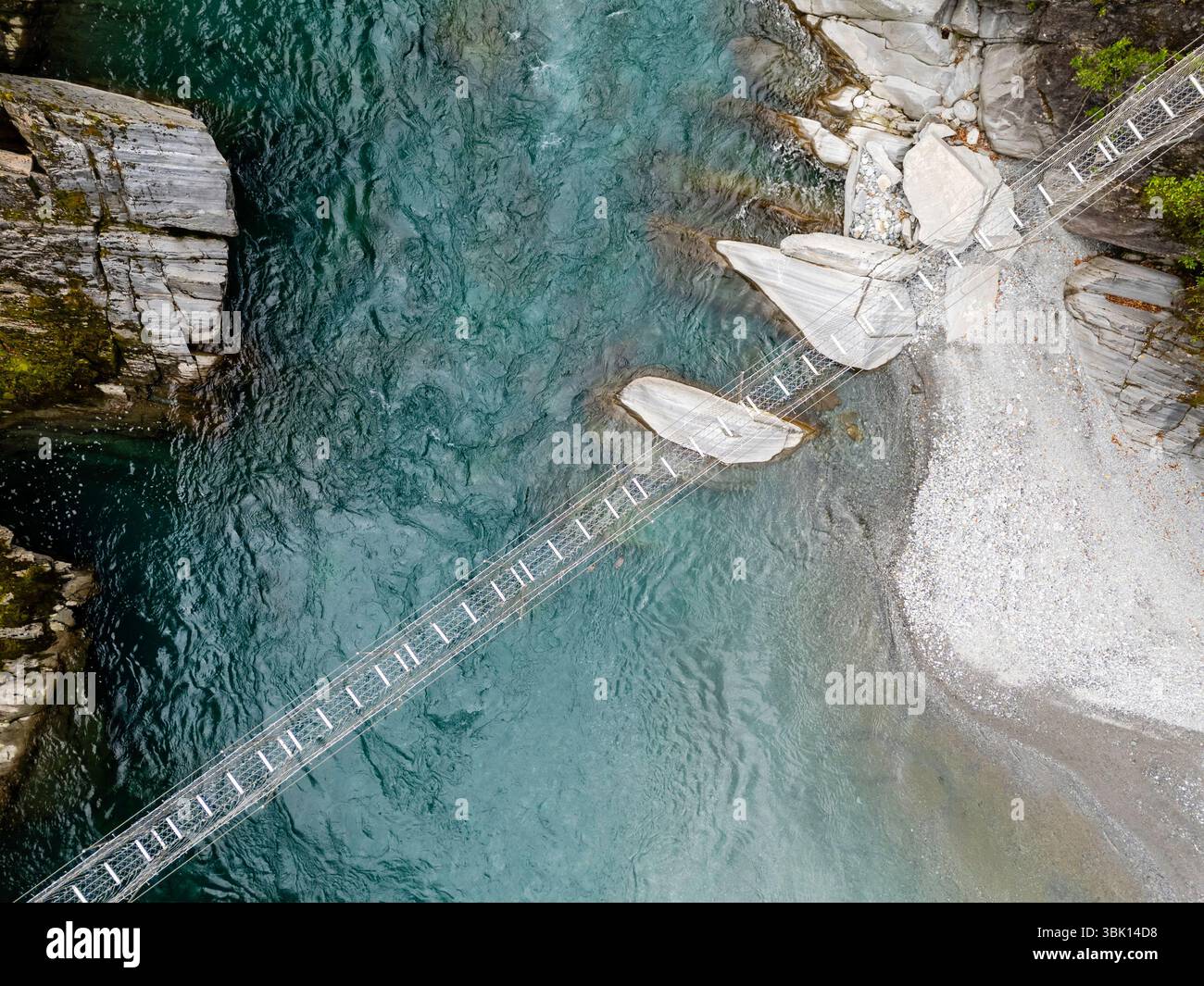 Aerial photograph of a suspension bridge at the Cesspool, Arahura River ...