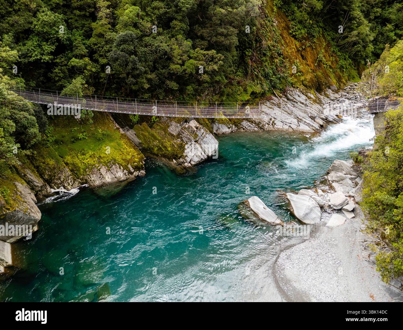 Aerial photograph of a suspension bridge at the Cesspool, Arahura River ...