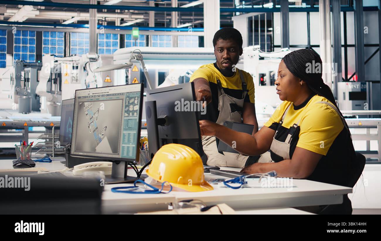 Engineers team in photovoltaics factory reviewing guidelines to ...