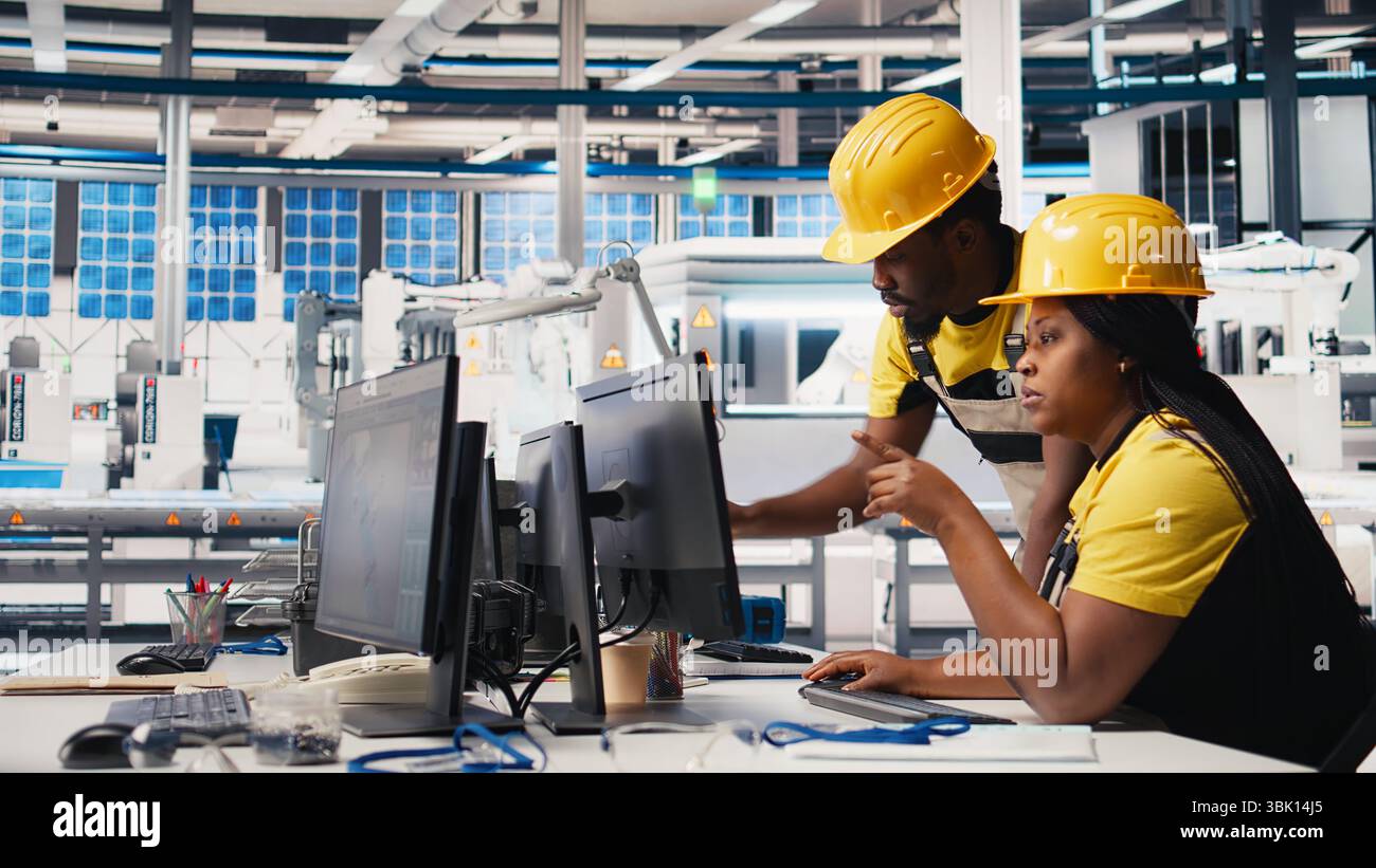 Team black engineers finetuning manufacturing hi-res stock photography ...