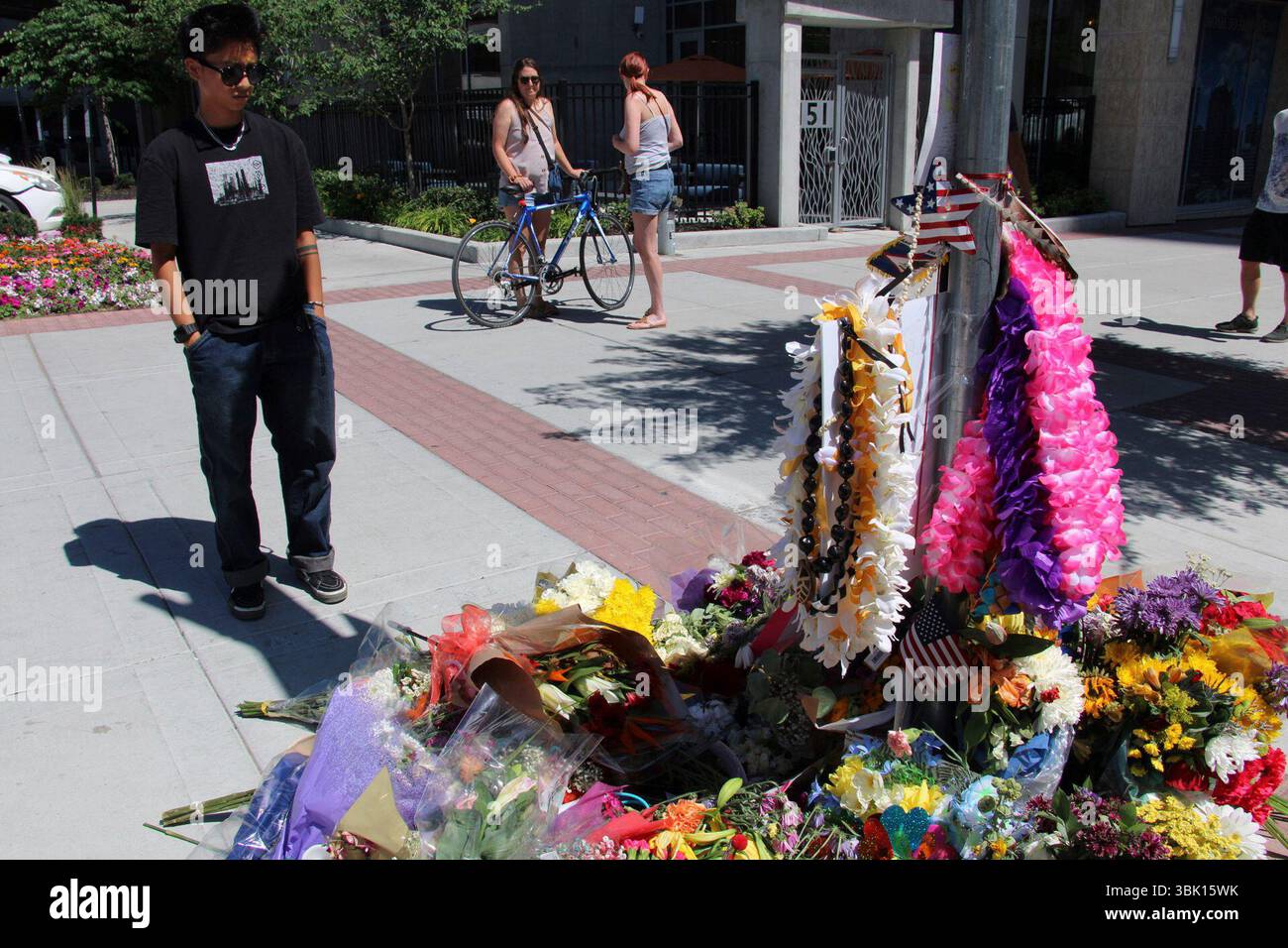 A young man pays his respects to Arthur Folasa Ah Loo, known to friends ...