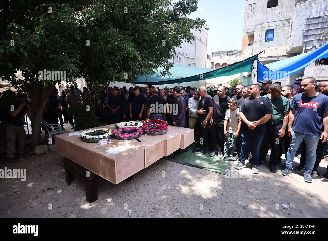 Tamra, Israel. 17th June, 2025. People attend a funeral for victims ...