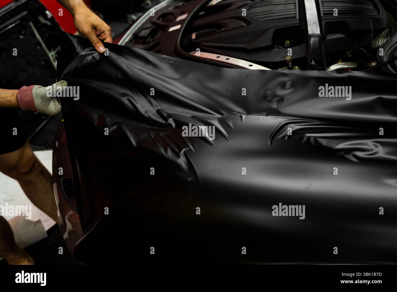 Careful application and tensioning of black vinyl avoids surface damage ...