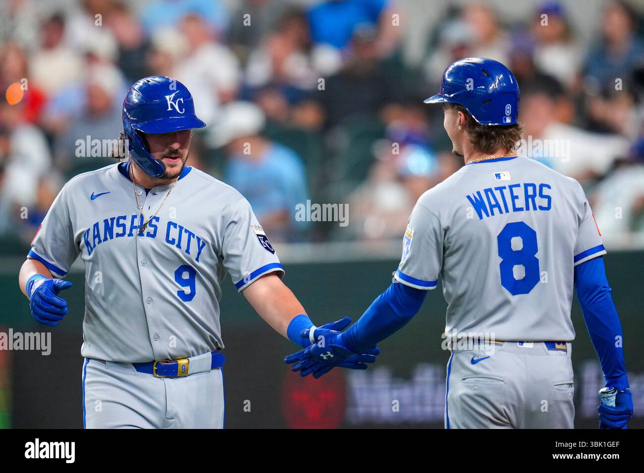 Kansas City Royals' Vinnie Pasquantino (9) is greeted near the dugout ...