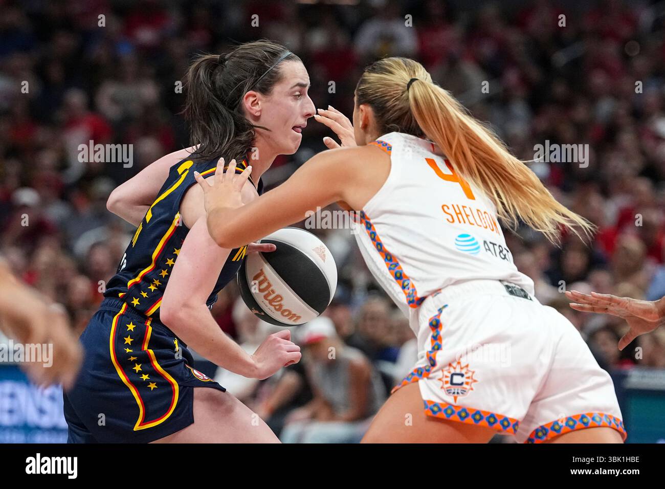 Connecticut Sun guard Jacy Sheldon (4) fouls Indiana Fever guard ...