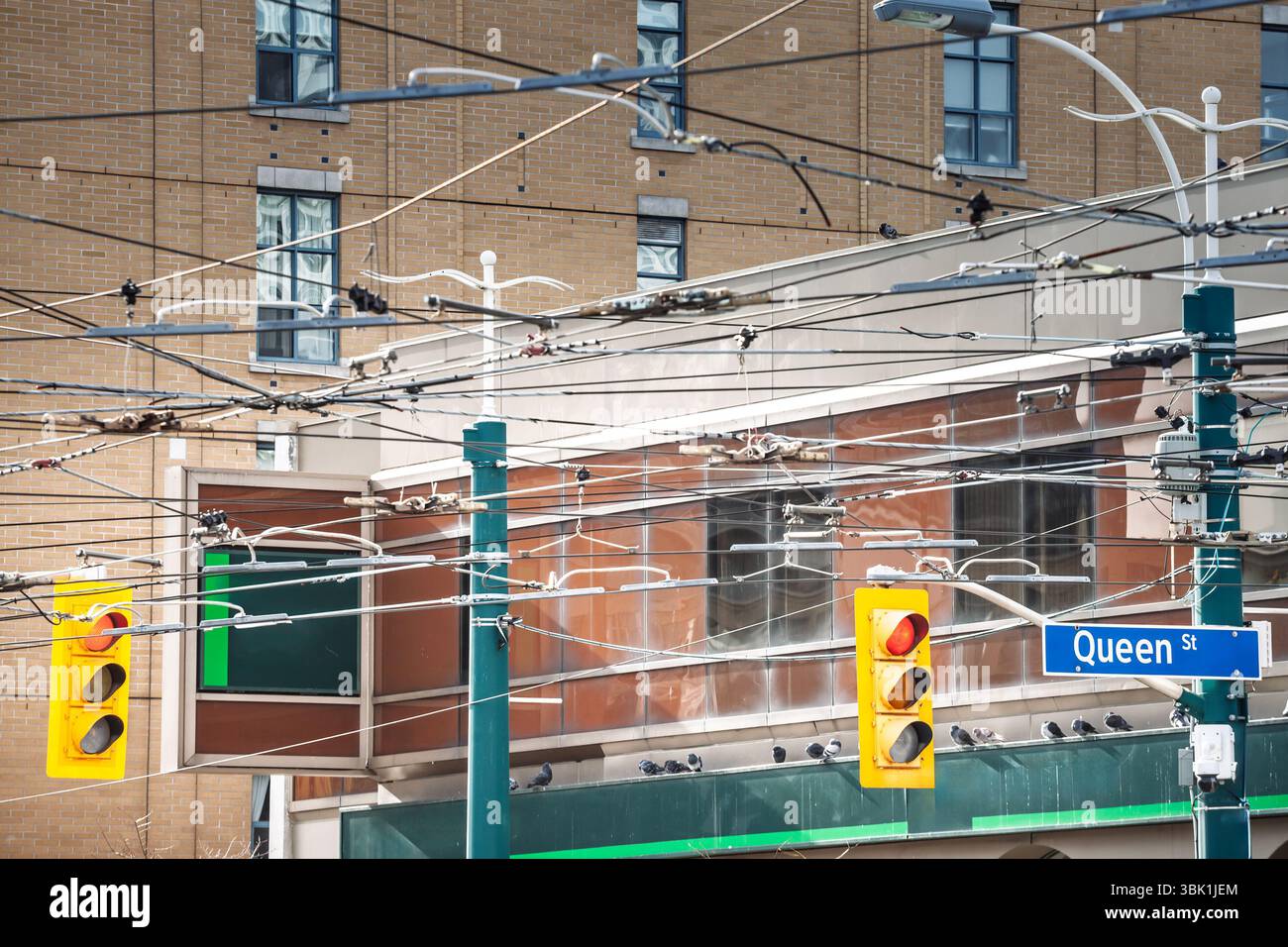 Dense web of trolley wires above Queen Street in downtown Toronto ...