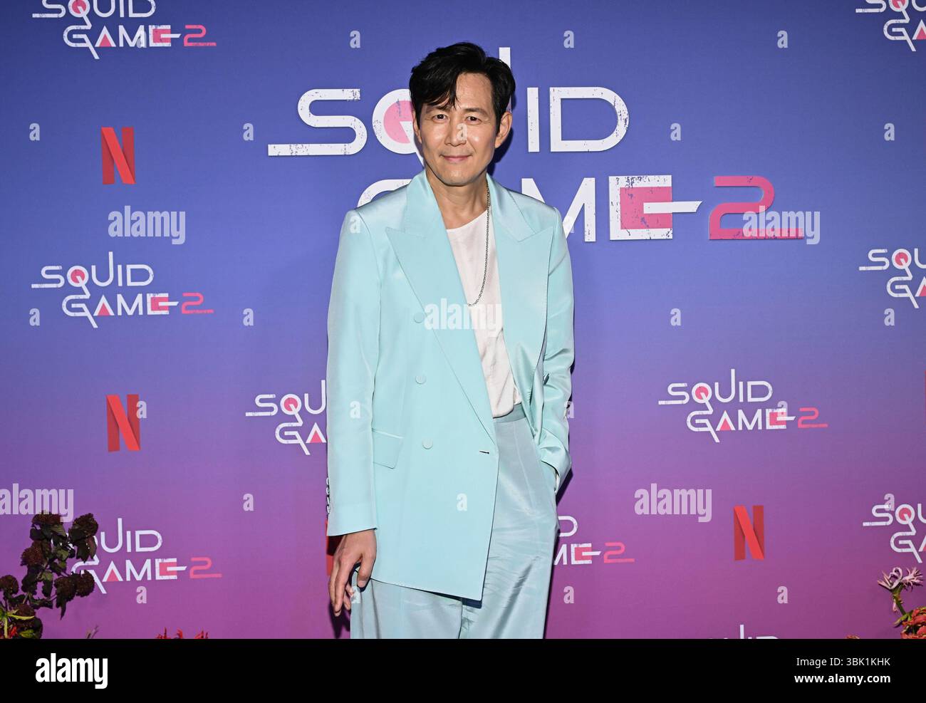 Lee Jung-jae poses at a Netflix "Squid Game" cast photo call at the ...
