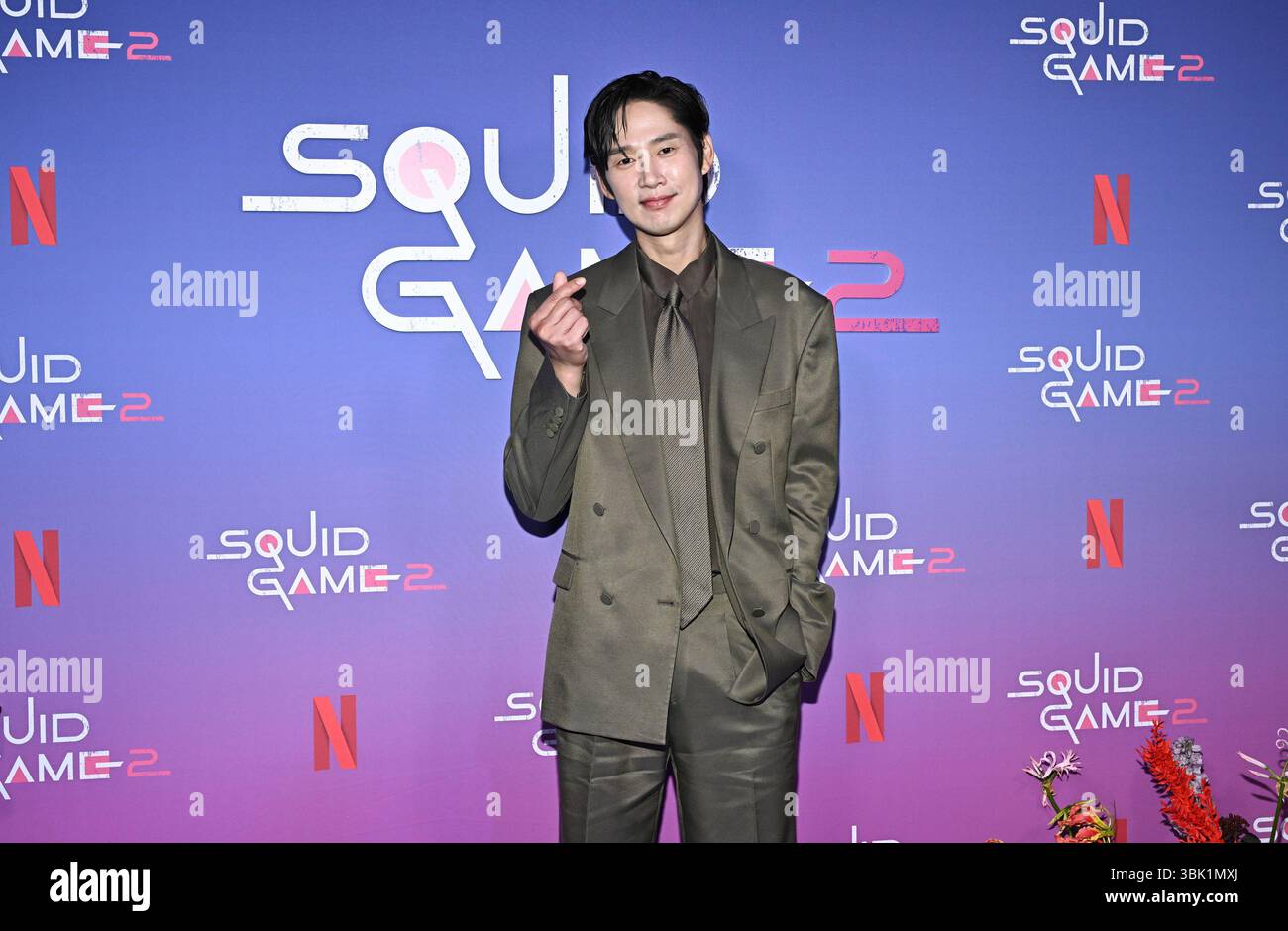 Park Sung-hoon poses at a Netflix "Squid Game" cast photo call at the Squid Game Experience in ...