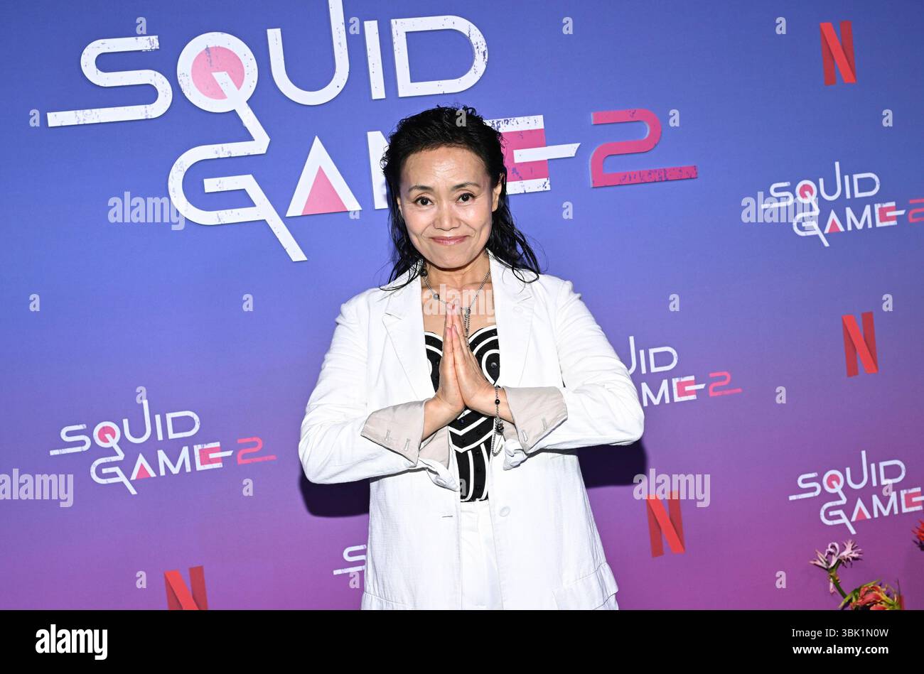 Kang Ae-sim poses at a Netflix "Squid Game" cast photo call at the Squid Game Experience in the ...
