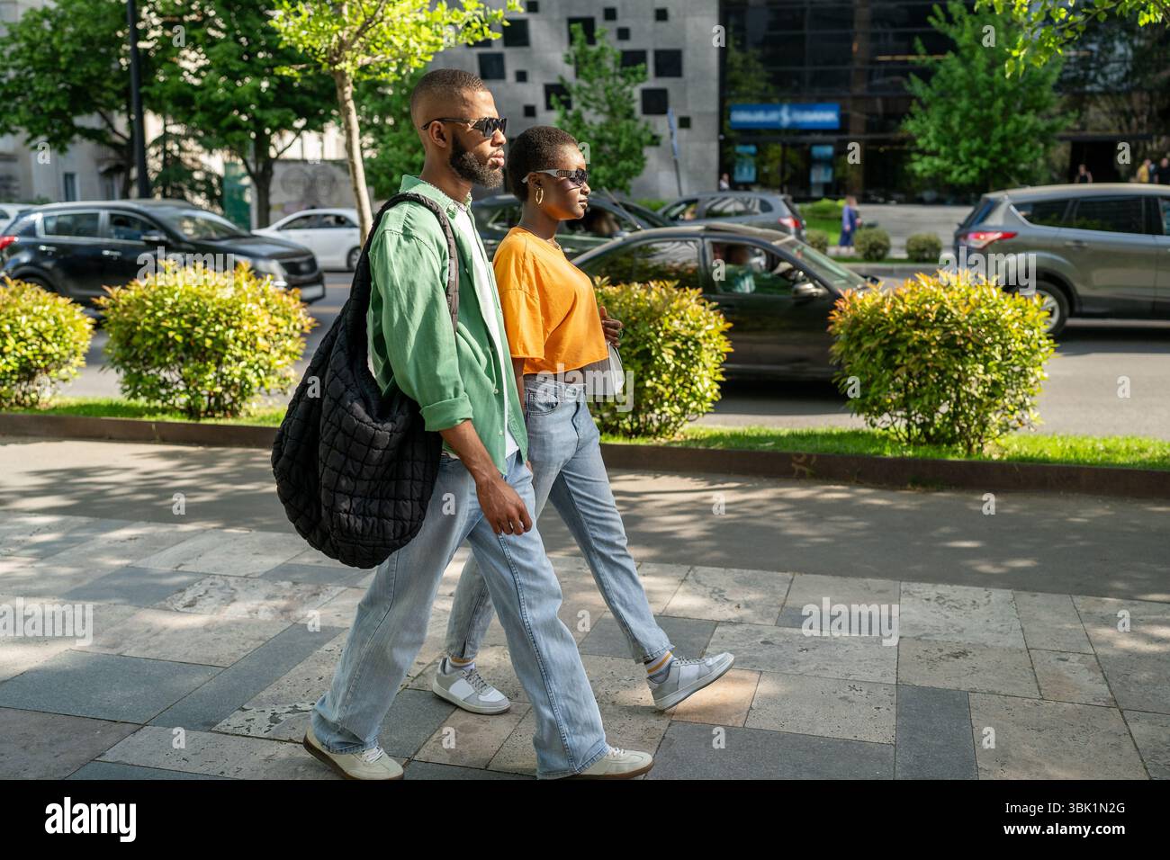Serious boyfriend and girlfriend on date. Black couple holding hands ...