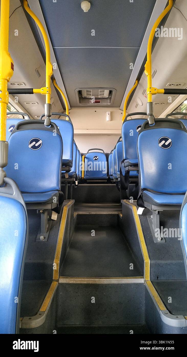 Interior view of a modern electric city bus, showing clean, organized ...