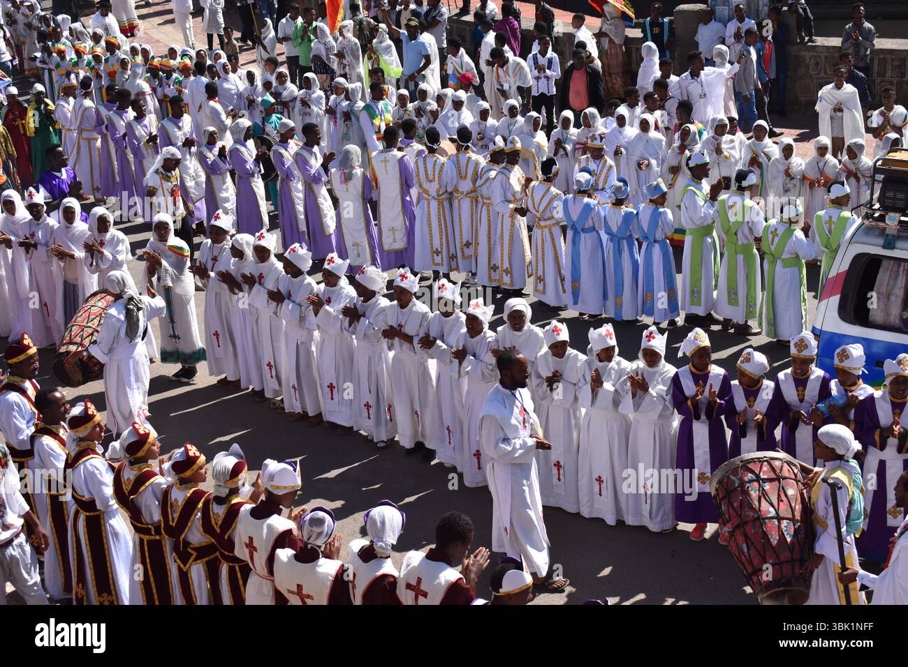 A procession of priests, deacons, musicians, and clergy celebrating ...