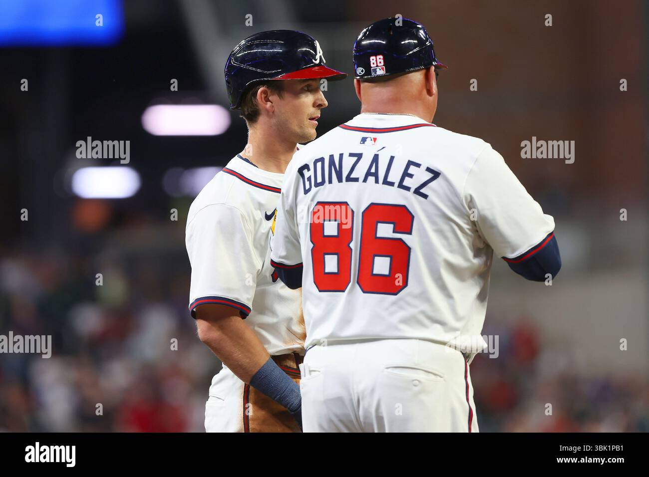 ATLANTA, GA - JUNE 17: Luke Williams #37 of the Atlanta Braves confers ...