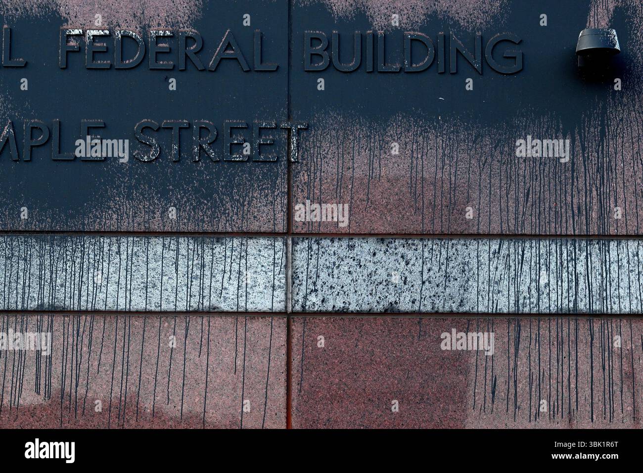 Spray paint remains on the Edward R. Roybal Federal Building Tuesday ...