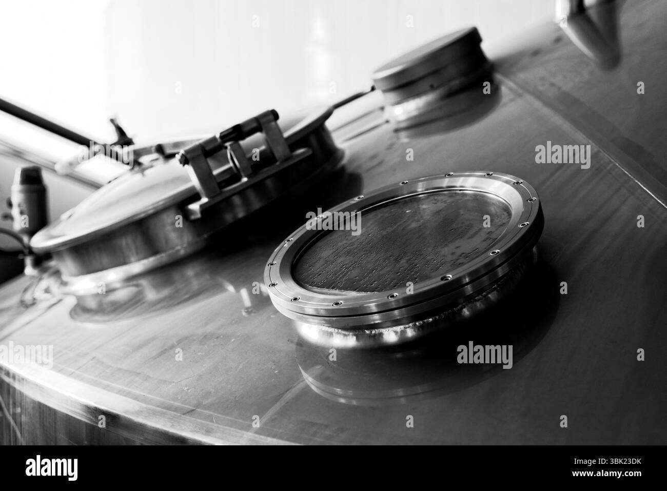 Beer factory with large storage tanks inside Stock Photo - Alamy