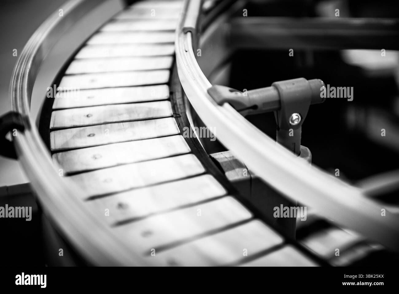 Small conveyor belt closeup photo in black and white Stock Photo - Alamy