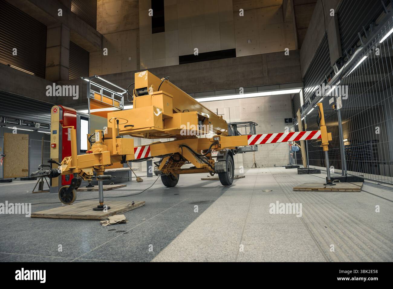 Yellow mobile industrial crane in a building interior Stock Photo - Alamy