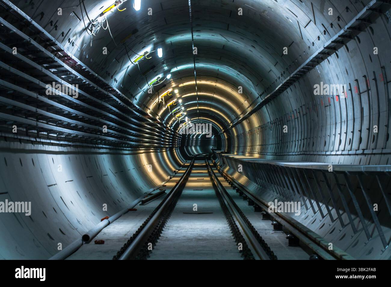 Underground facility with a big tunnel leading deep down Stock Photo ...