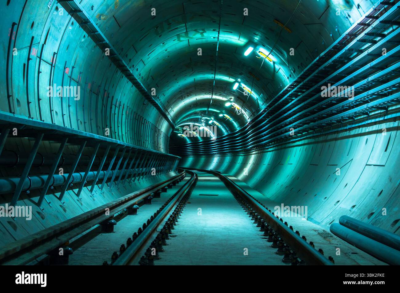 Underground facility with a big tunnel leading deep down Stock Photo ...